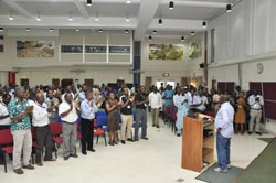 iita-staff-applaud-dg-sanginga-standing-behind-the-podium-for-a-job ...